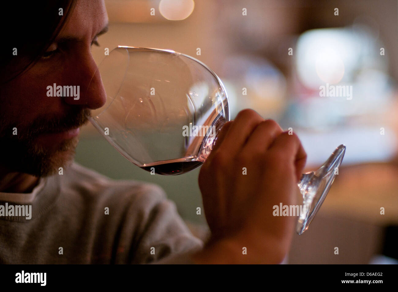 Man Sniffing Glass of Red Wine Stock Photo - Alamy
