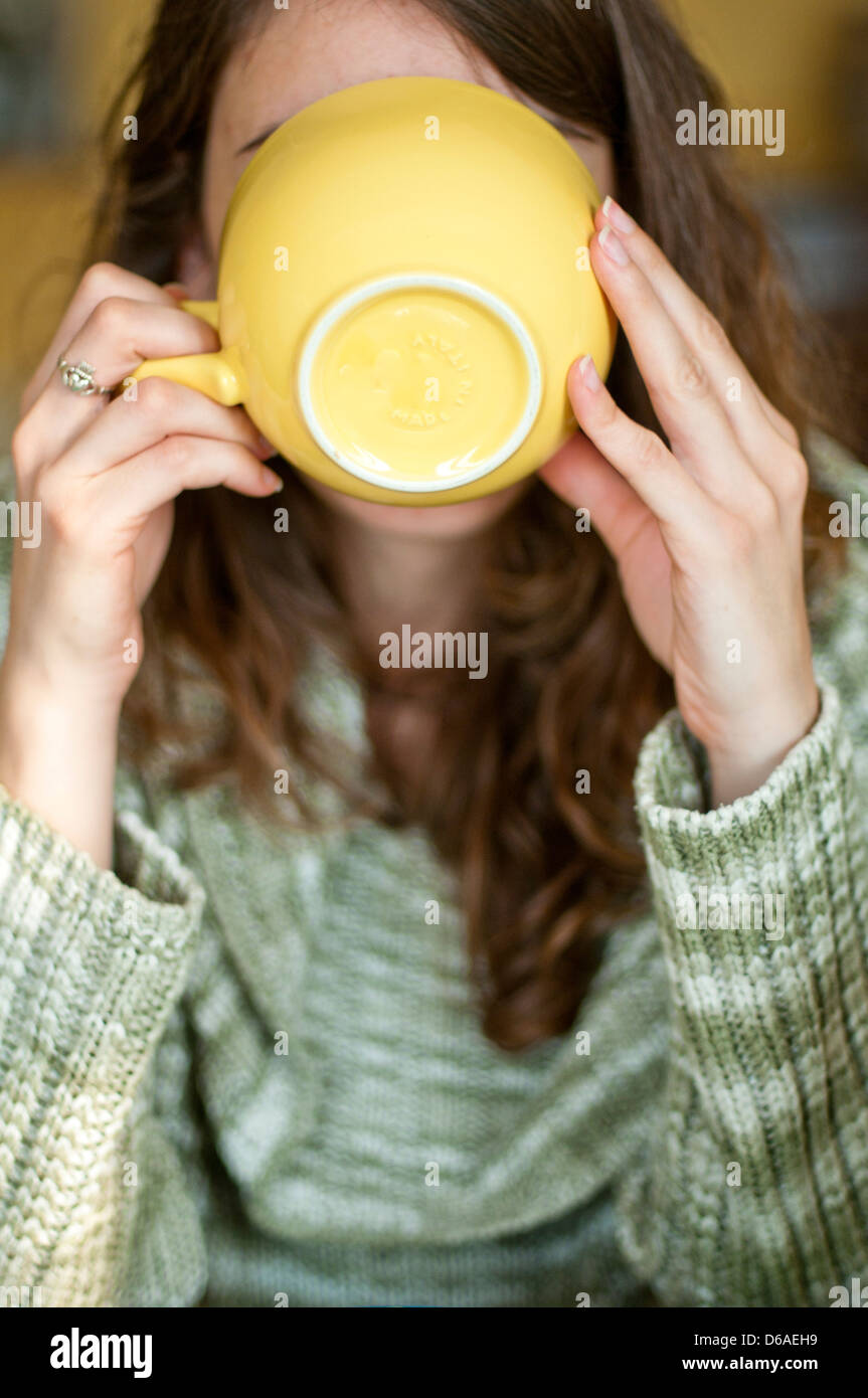 Woman Drinking Coffee from Large Cup Stock Photo - Alamy