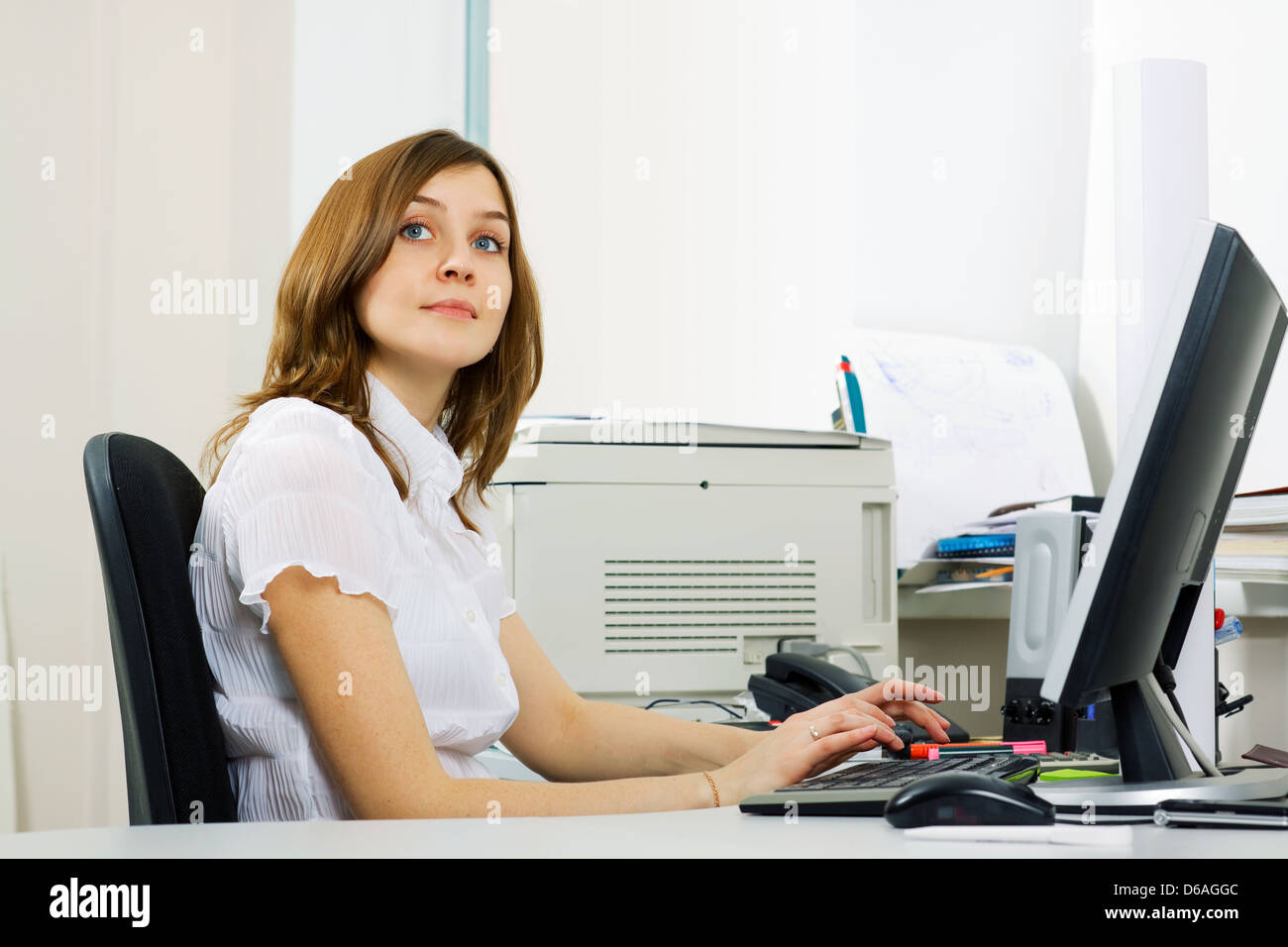 Young businesswoman using computer Stock Photo - Alamy