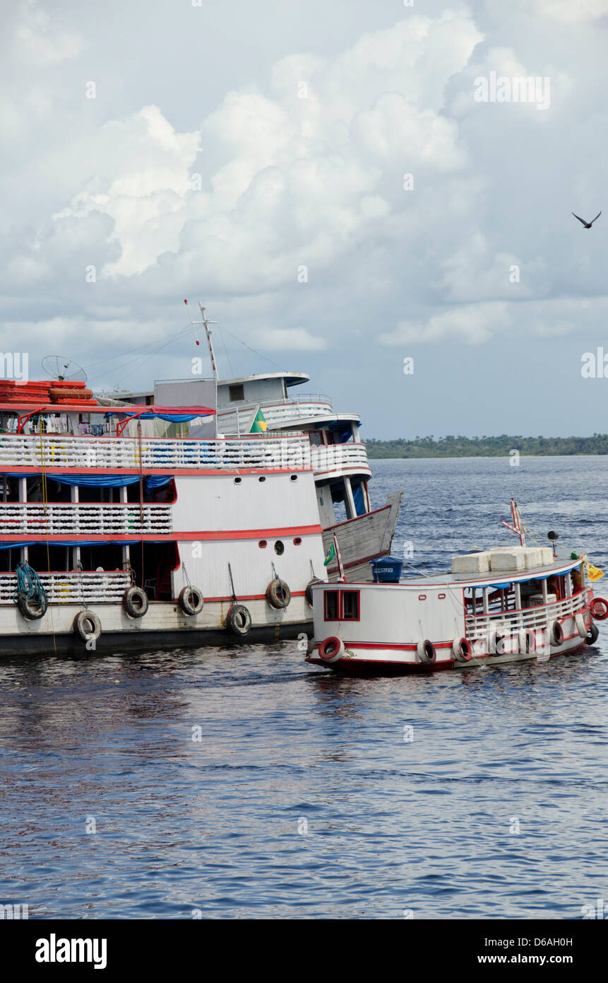 Brazil, Amazon, Manaus. Busy waterfront pier with traditional Amazon ...