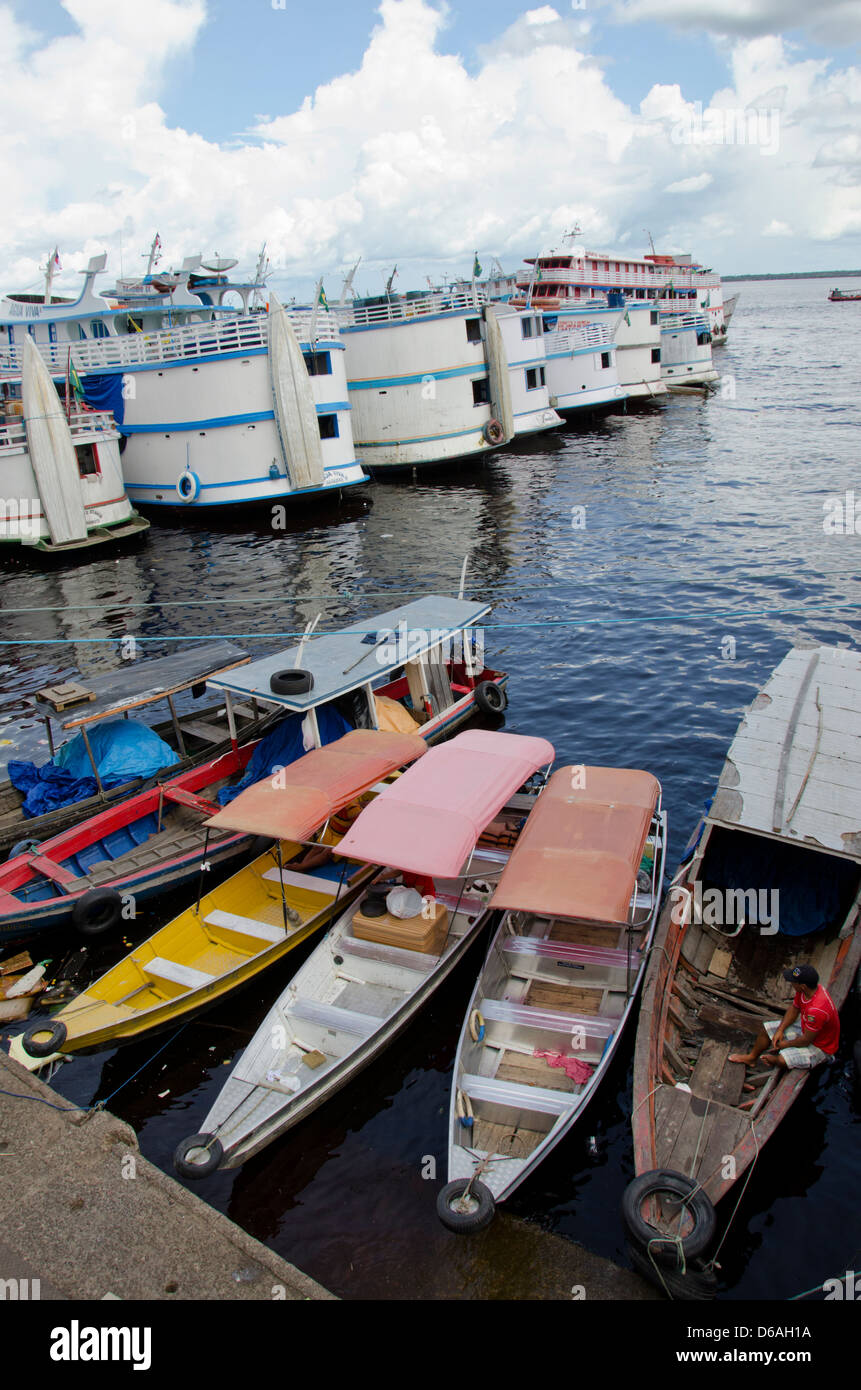 Brazil, Amazon, Manaus. Busy waterfront pier with traditional Amazon ...