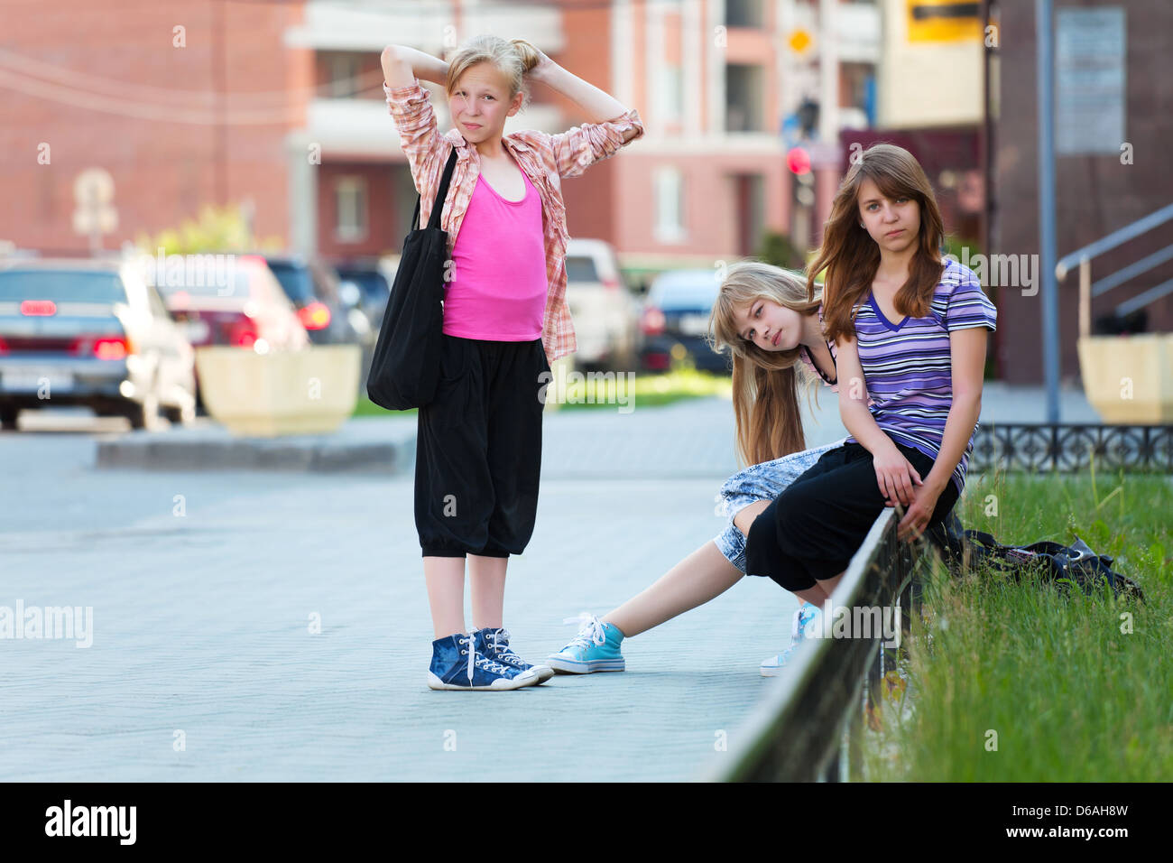 Teenage girls on a city street Stock Photo - Alamy