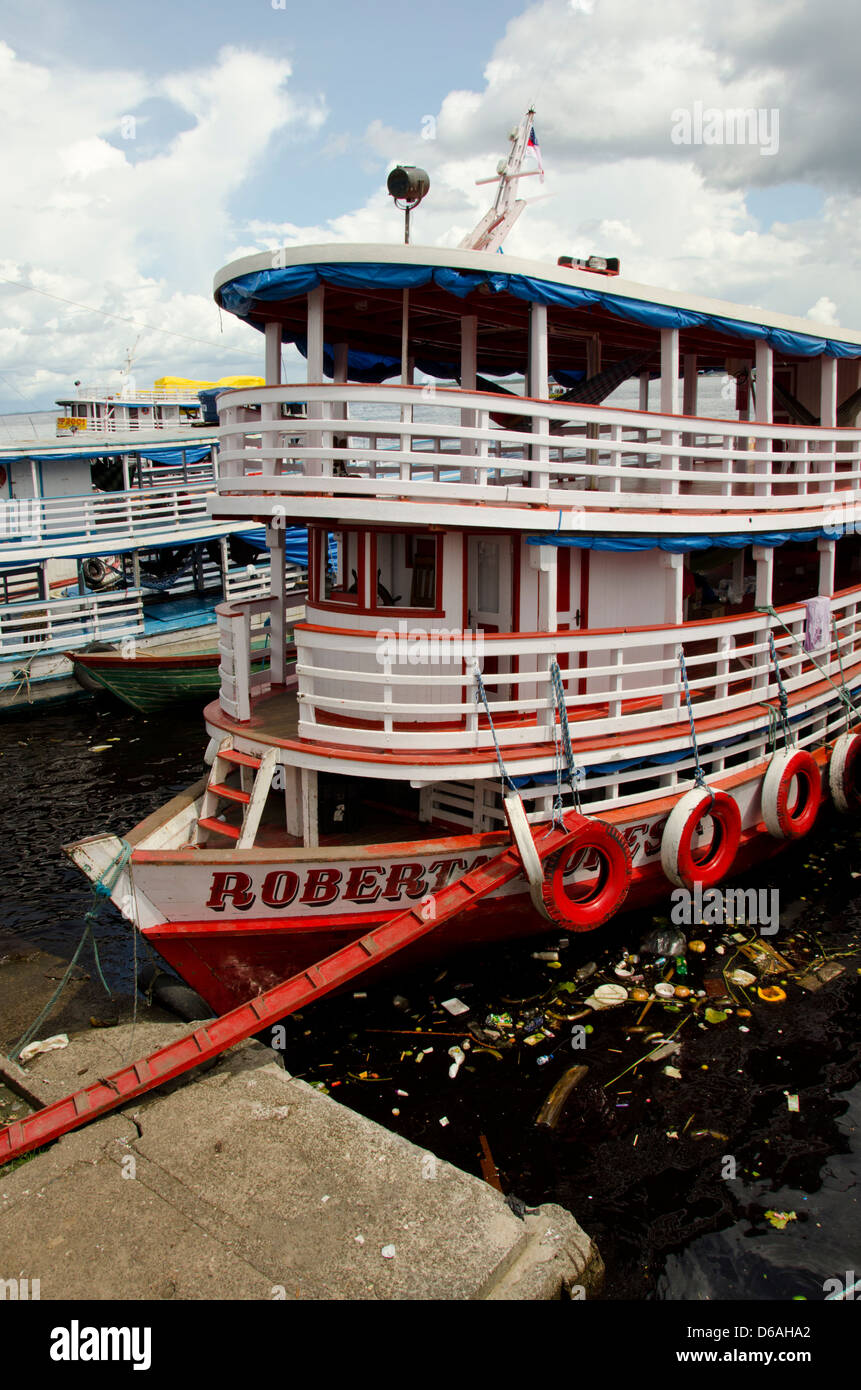 Brazil, Amazon, Manaus. Typical Amazon riverboat with rubbish in the ...