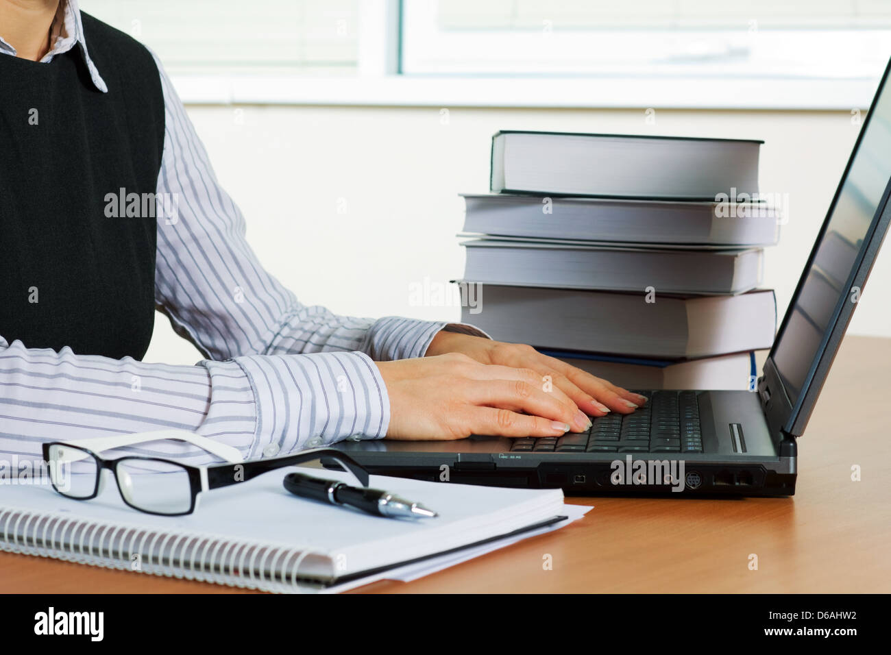 Female hands using laptop Stock Photo - Alamy