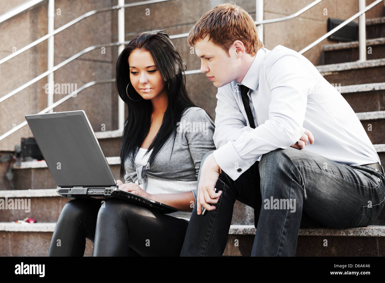 Young students on the steps Stock Photo - Alamy