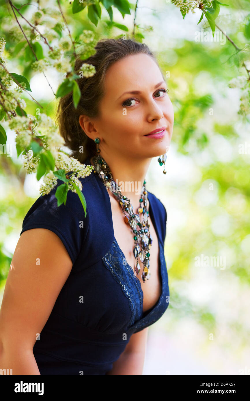 Beautiful woman in a spring garden Stock Photo - Alamy