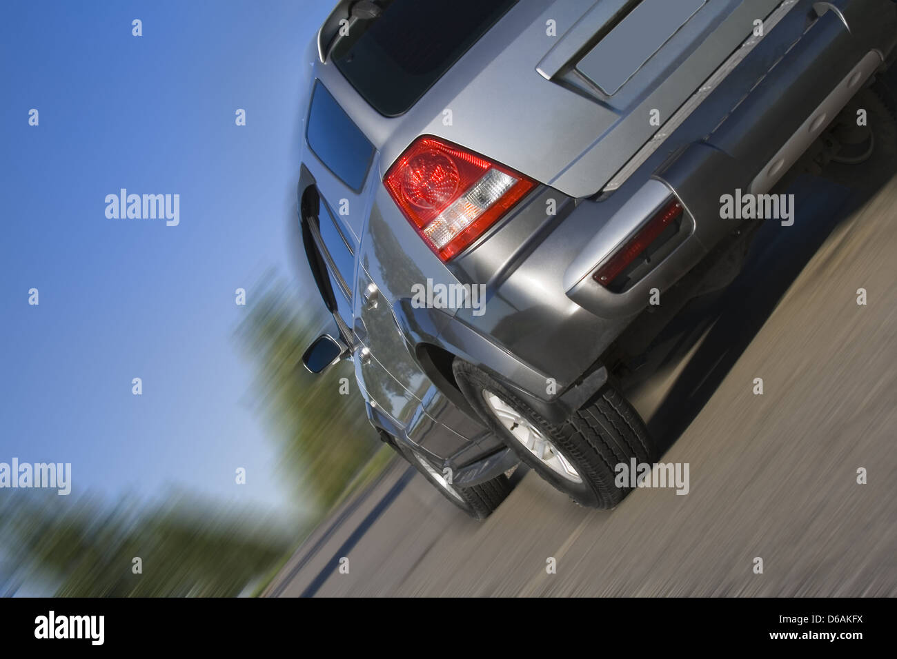 Modern SUV moving with motion blur Stock Photo - Alamy
