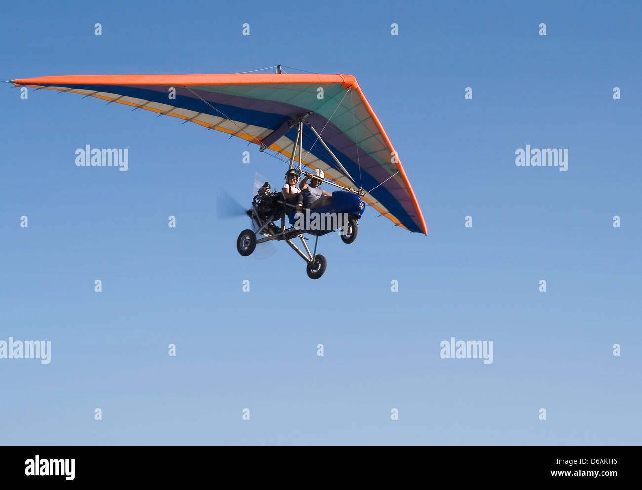 Extreme flight on deltaplane in a blue sky Stock Photo - Alamy