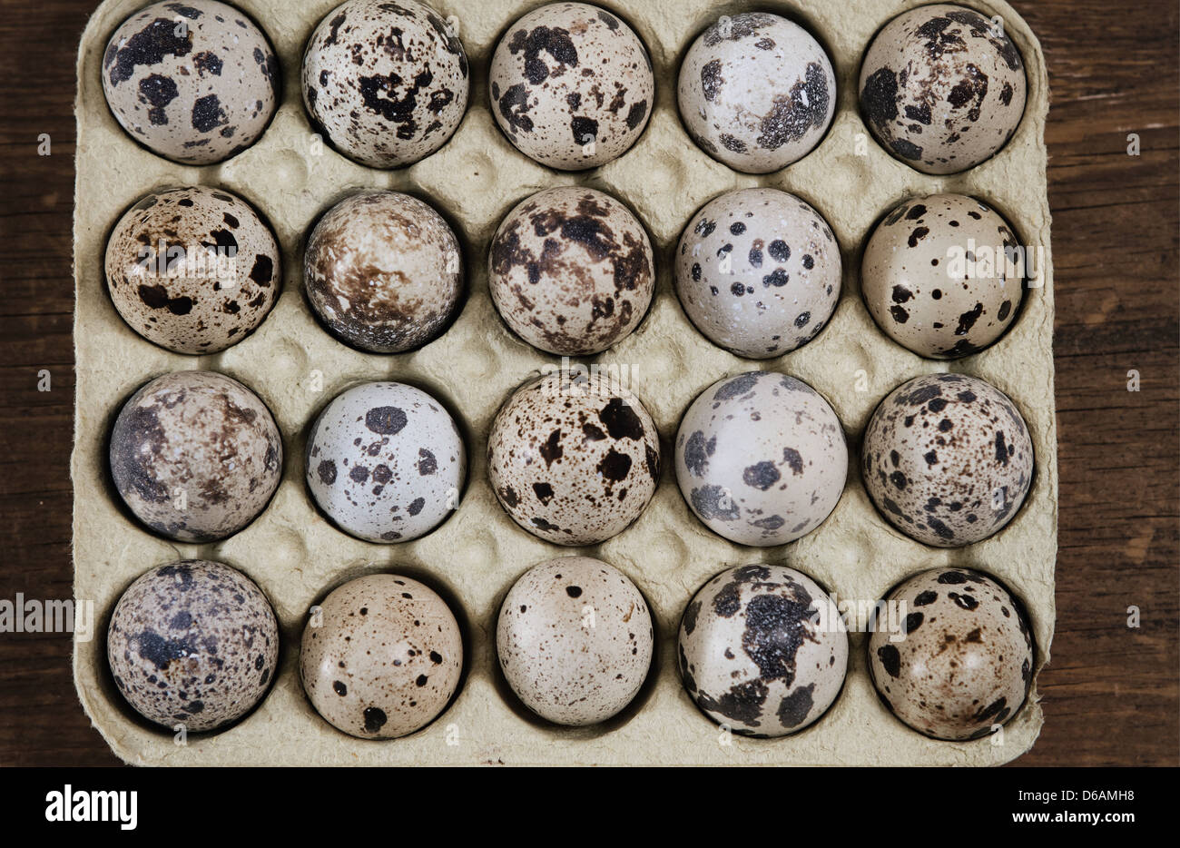 Spotted eggs on wooden background Stock Photo - Alamy