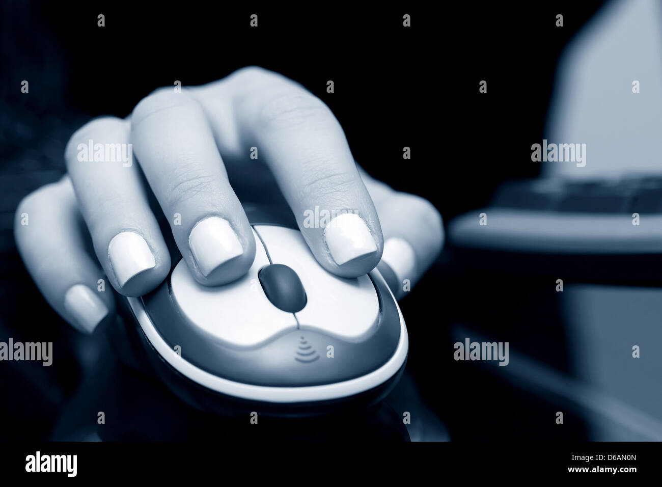 Female hand holding computer mouse Stock Photo - Alamy