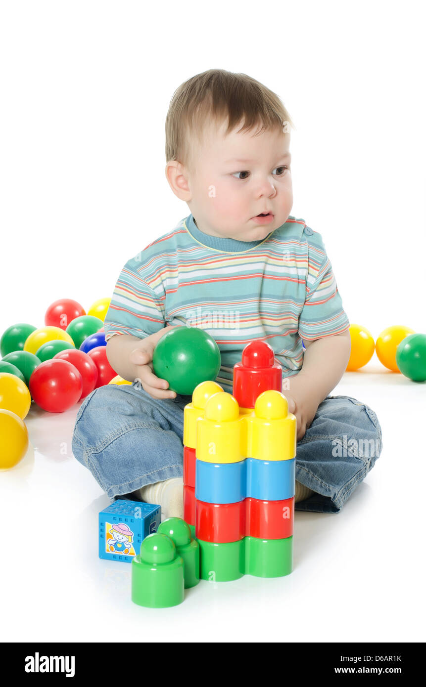 The little boy plays multi-coloured toys Stock Photo - Alamy