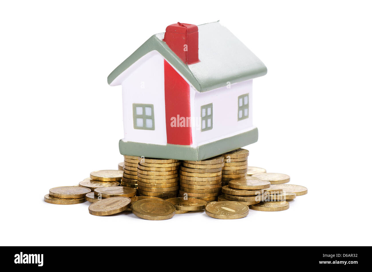 Toy small house and coins Stock Photo - Alamy