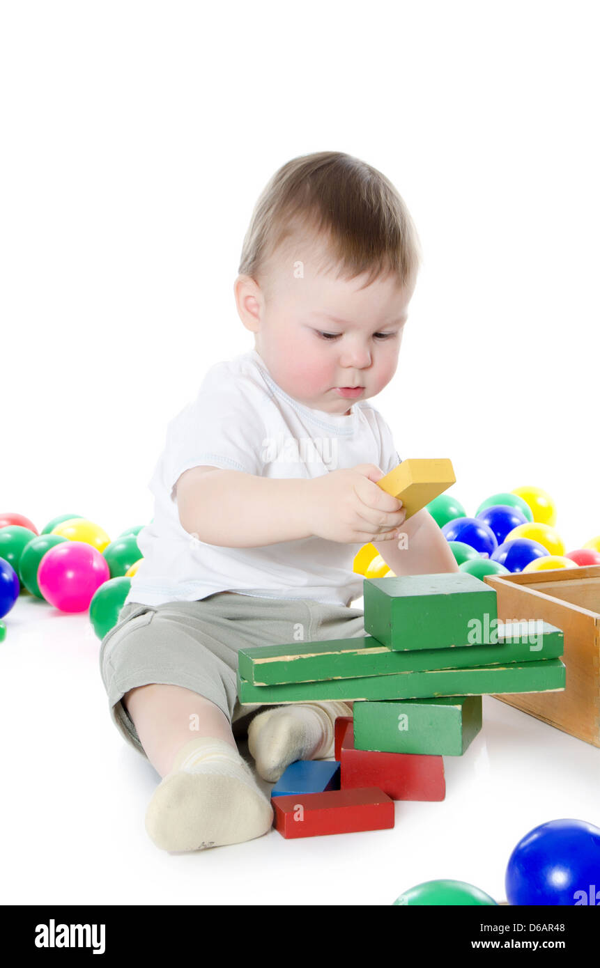 The little boy plays multi-coloured toys Stock Photo - Alamy