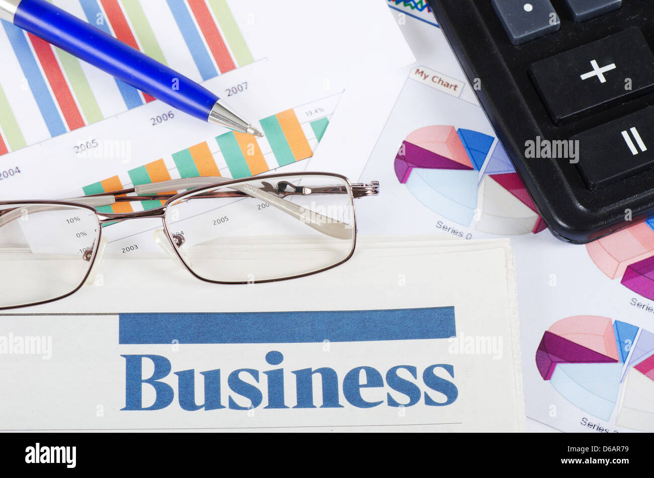 Business the newspaper with chart Stock Photo - Alamy