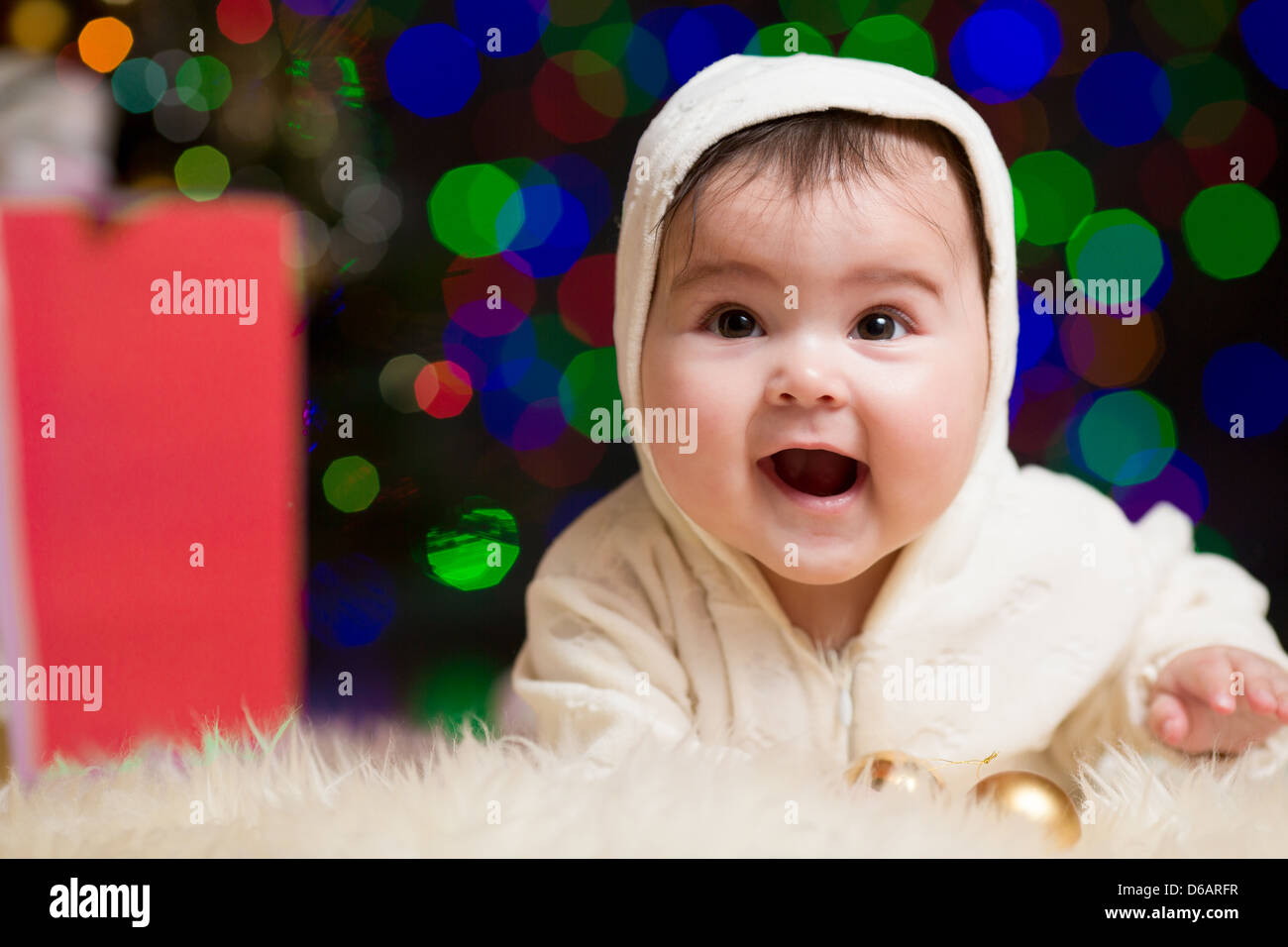 Happy girl lying under tree hi-res stock photography and images - Alamy