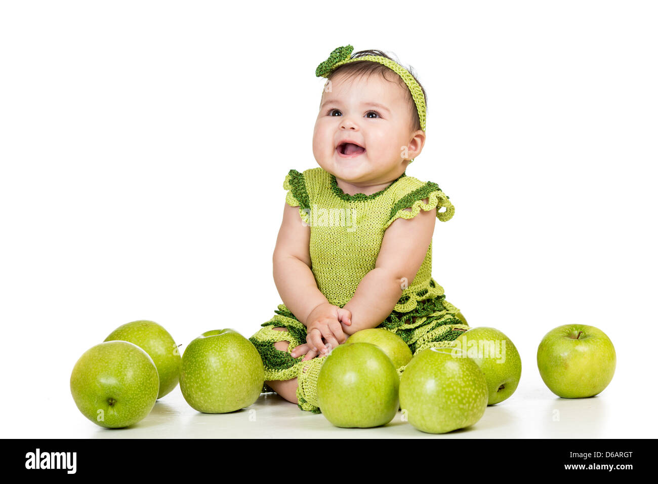 happy baby girl with green apples isolated on white background Stock ...