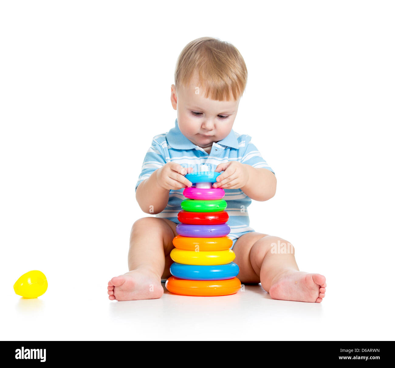 baby boy playing with colorful toy Stock Photo - Alamy