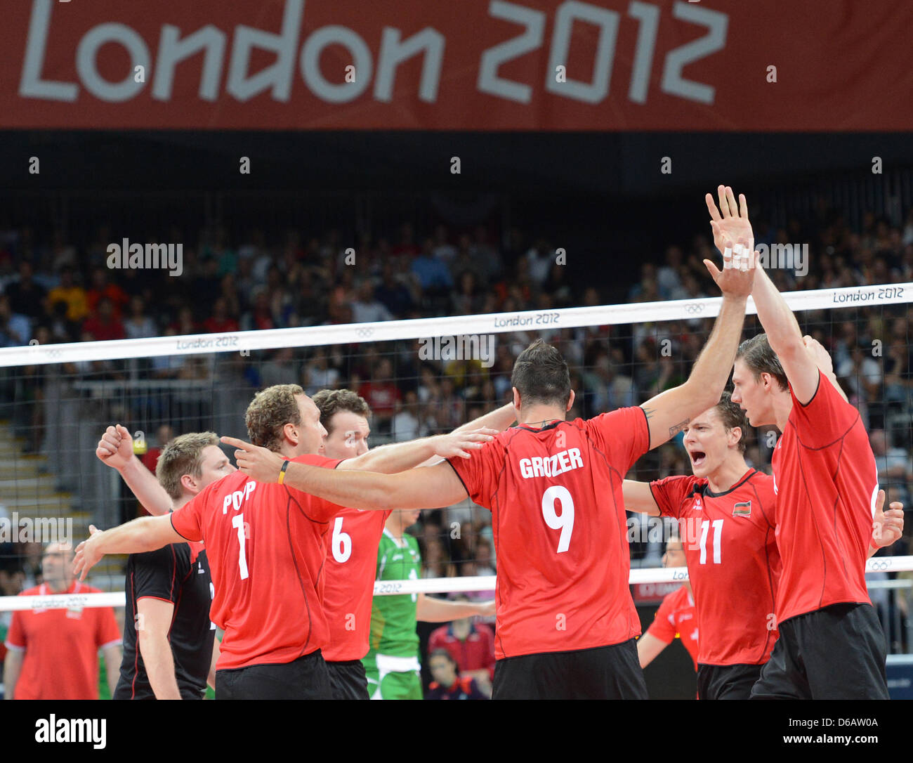Marcus Popp (L) and Georg Grozer (C) of Germany celebrate during the ...