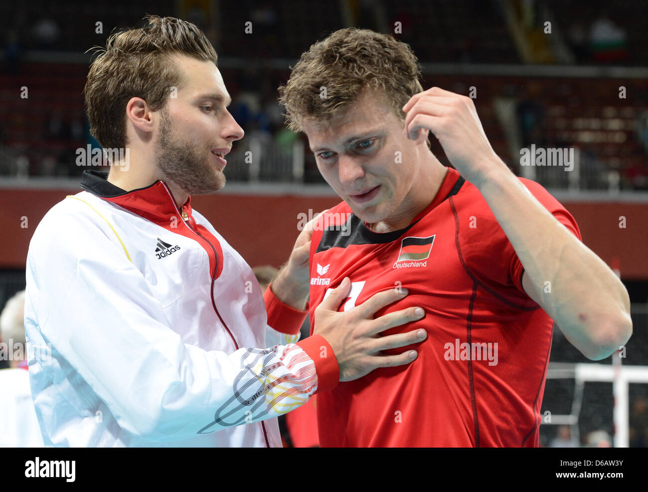 Germany's player Simon Tischer (L) and Lukas Kampa look dejected after ...