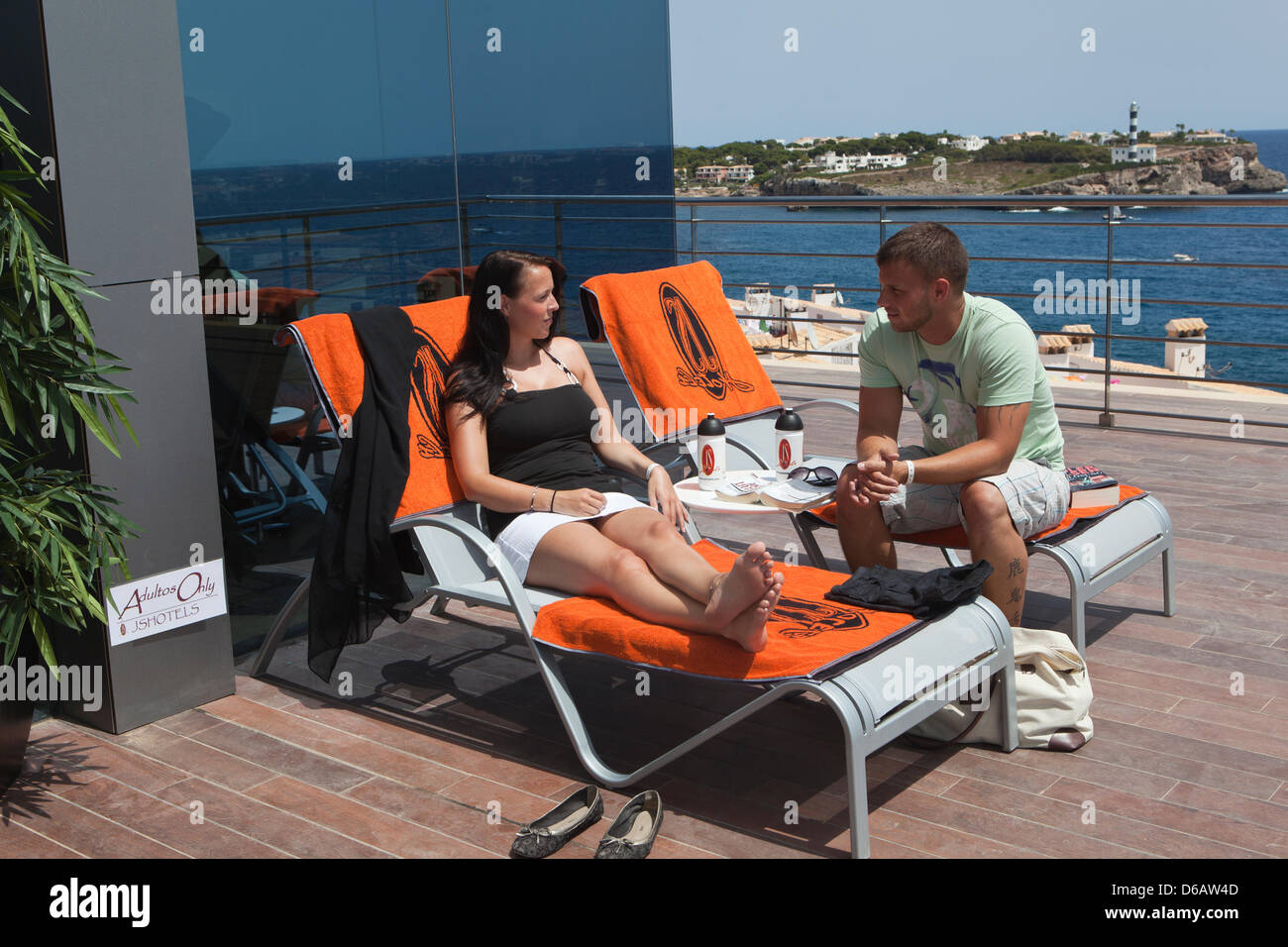 Tourists Nadine and Patrick Kraus relax on the sun terrace of the child ...