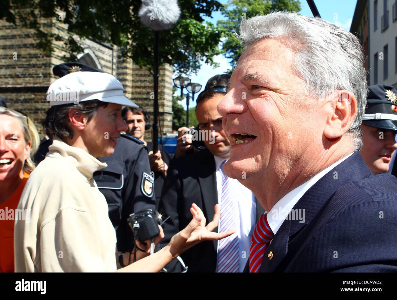German President Joachim Gauck greets citizens of Rostock in front of ...