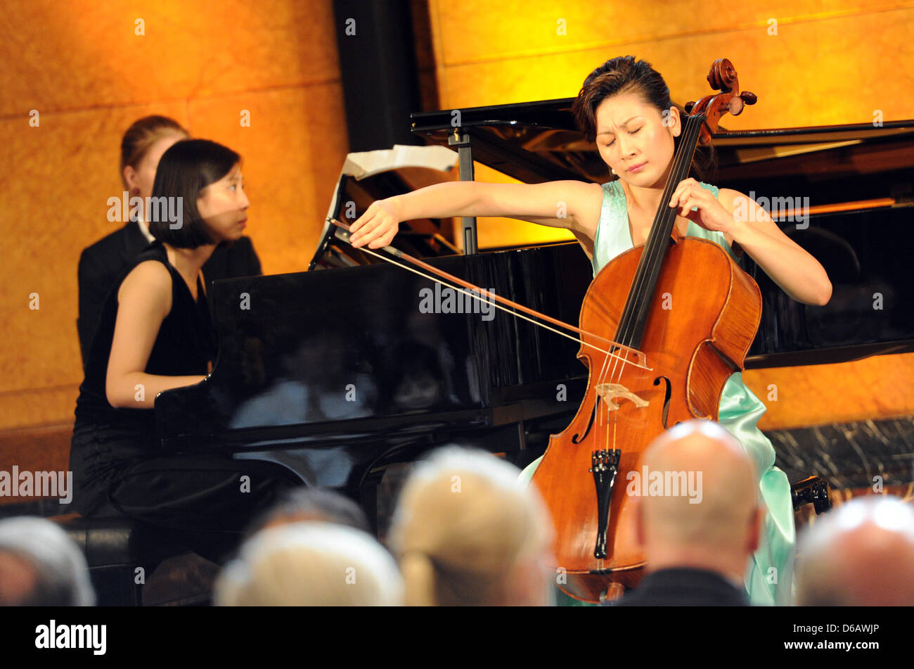 Cellist Zhao Jing, accompanied by pianist Han Huijing (L), performs the ...