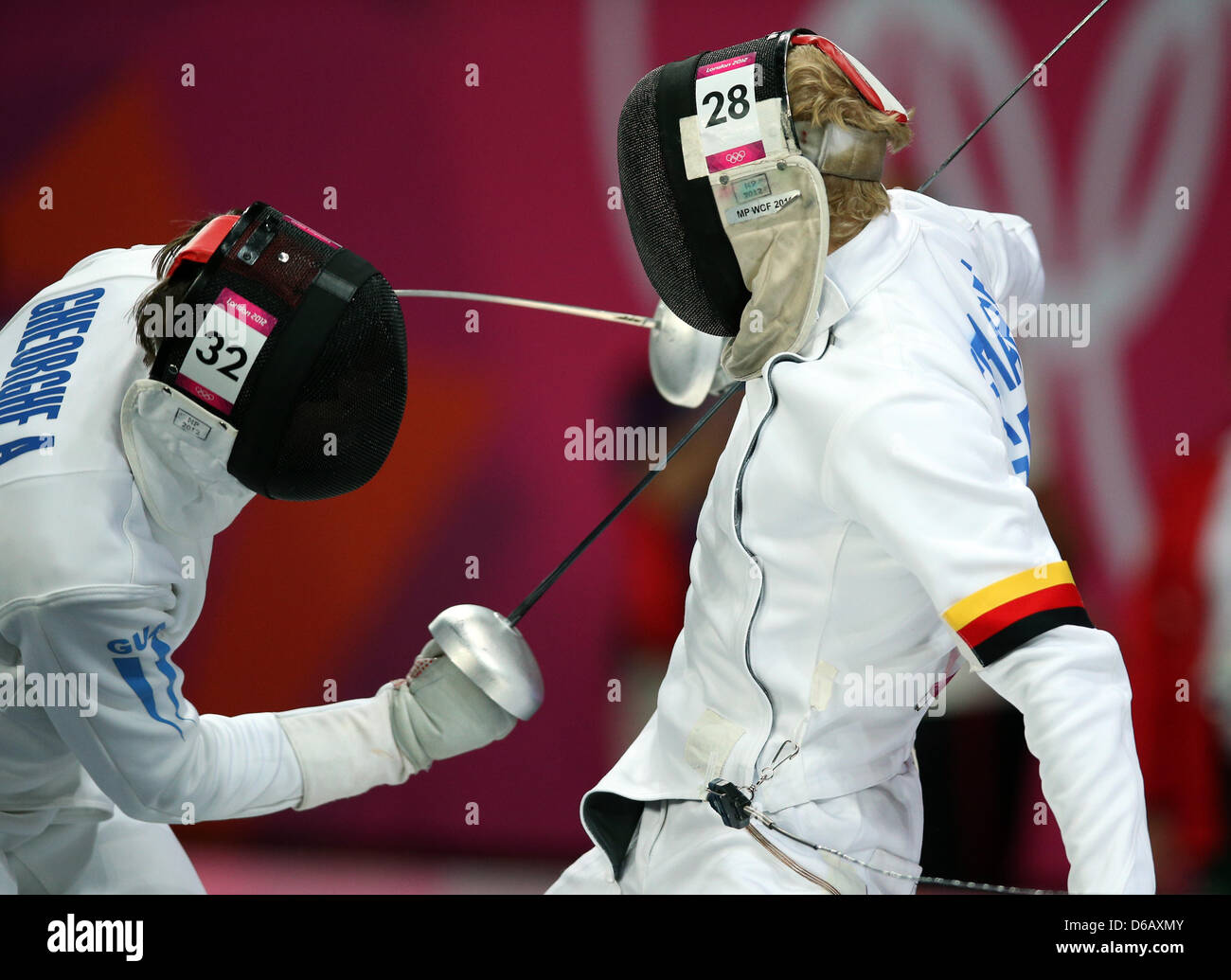 German Steffen Gebhardt (R) fences Andrei Gheorghe of Guatemala during ...