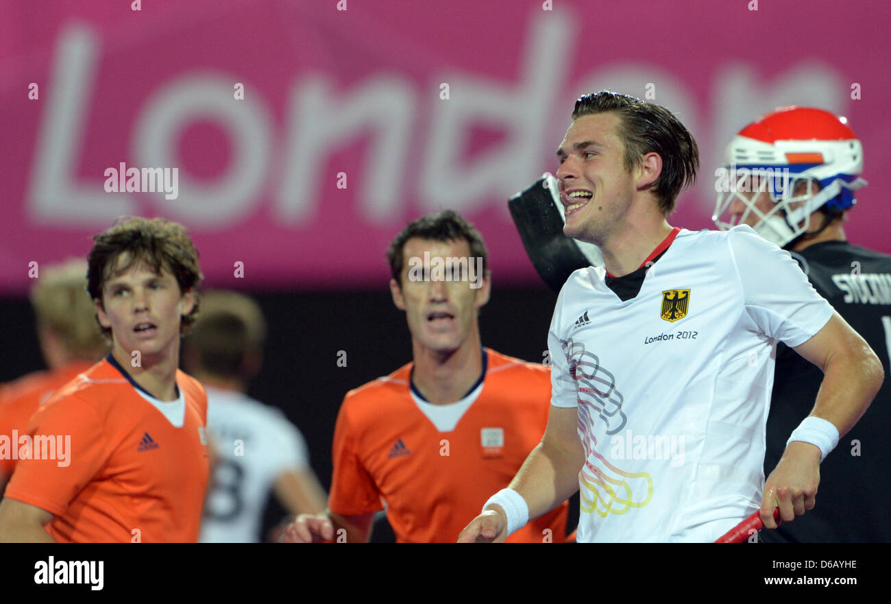 Germany's field hockey player Christopher Wesley (R) celebrates after ...