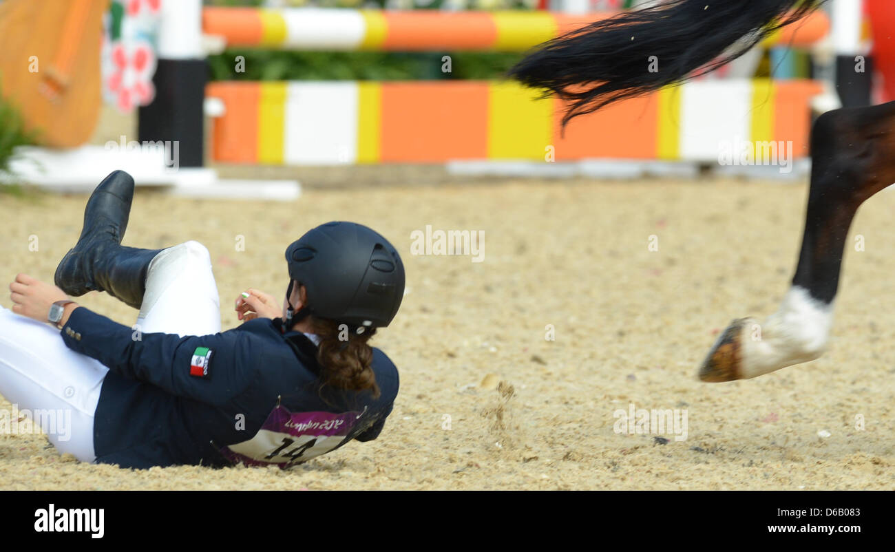 Mexico's Tamara Vega falls of her horse Douce De Roulad during women's ...