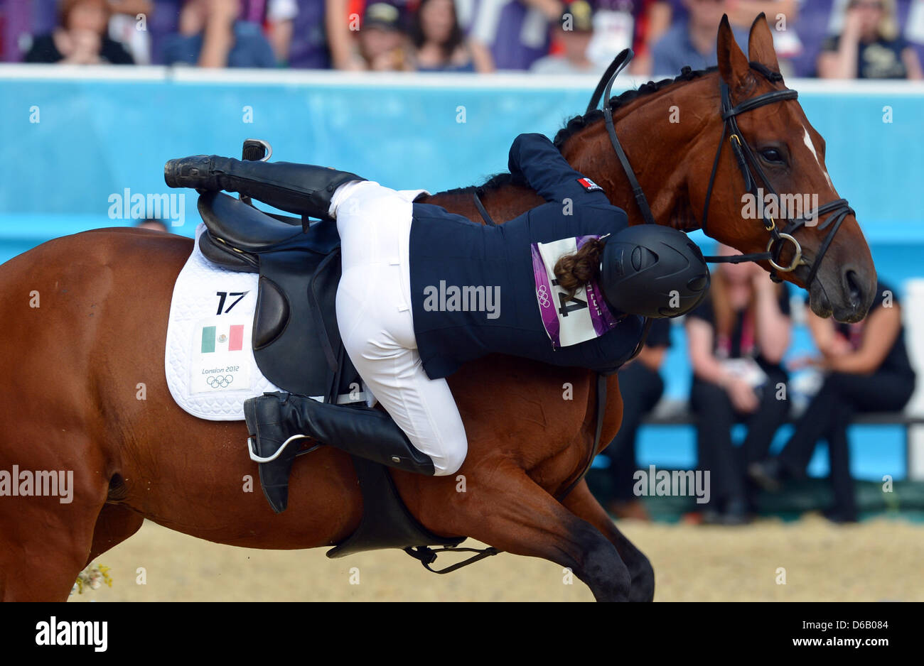 Mexico's Tamara Vega falls of her horse Douce De Roulad during women's ...