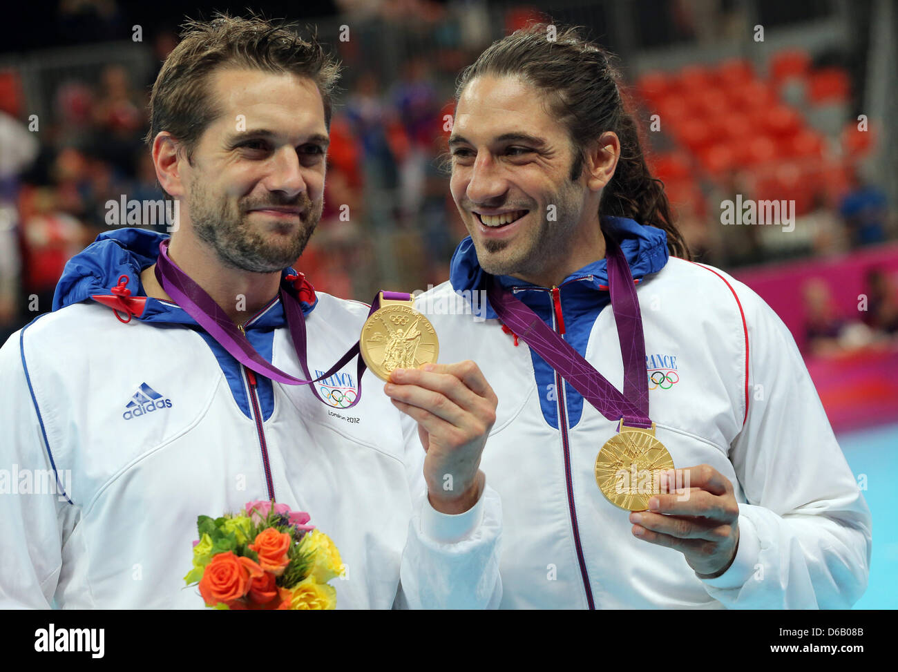 Celebrate with their gold medals hi-res stock photography and images ...
