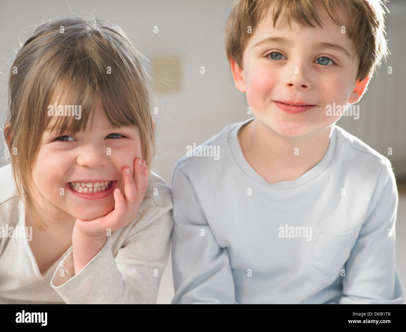 Children smiling together indoors Stock Photo - Alamy