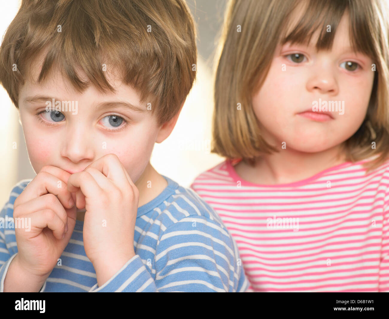 Children sitting together indoors Stock Photo - Alamy