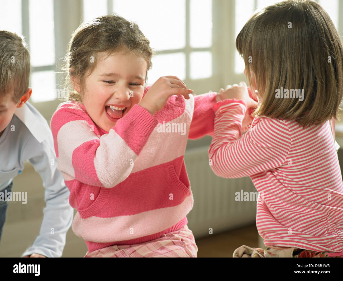 Children playing together indoors Stock Photo - Alamy