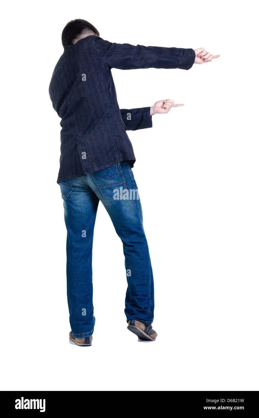 young man pointing at wall. rear view. Isolated over white Stock Photo ...