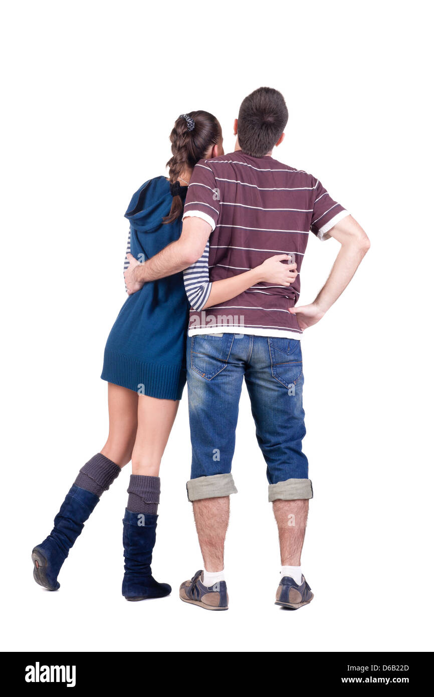 Young couple looks where that. Rear view. Isolated over white Stock ...