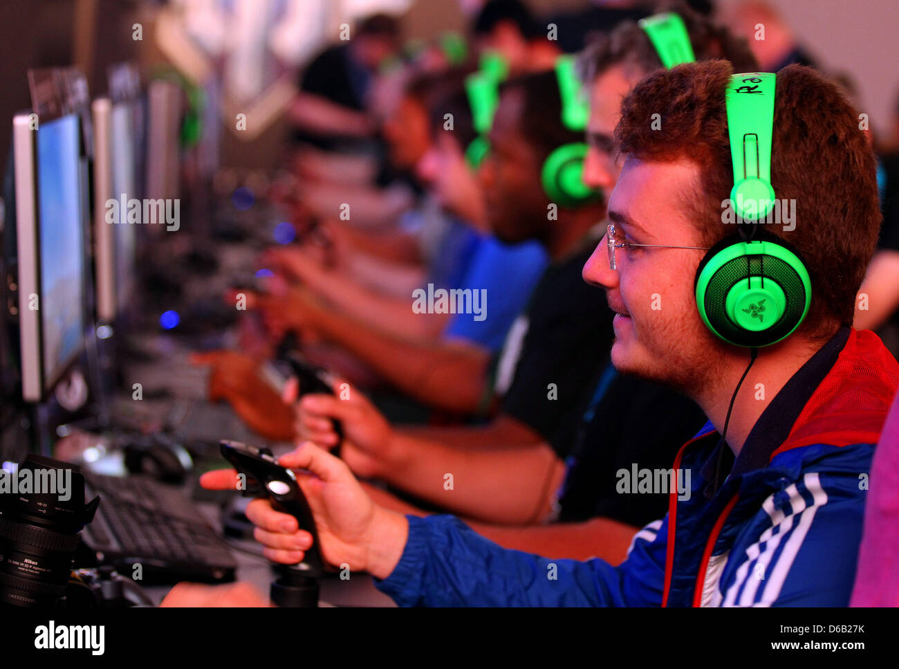 Computer gamers sit in front of screens in Cologne, Germany, 15 August ...
