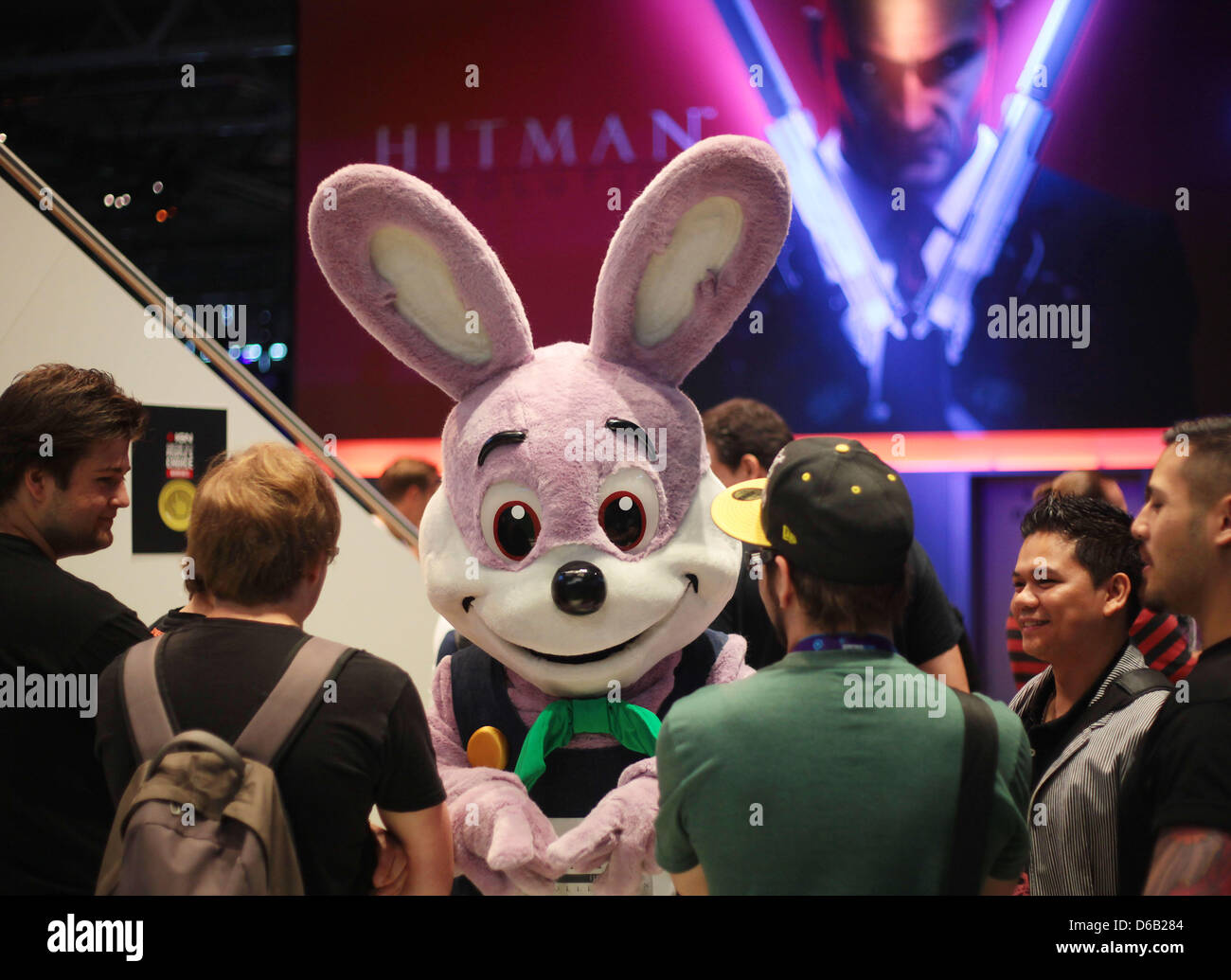 Computer gaming fans queue in front of an exhibition booth in Cologne ...