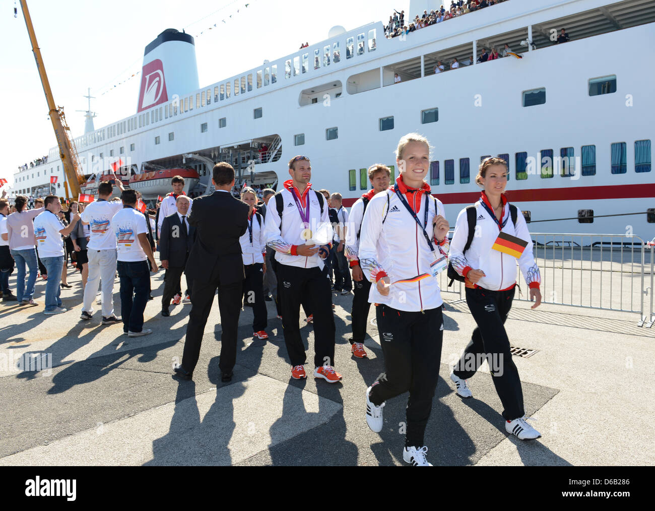 Members of the German Olympic Team 2012 disembark from cruise ship MS ...