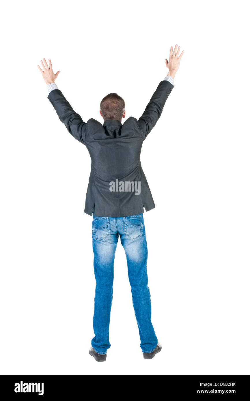 Back view of shocked and scared young business man. Holds hands upwards ...