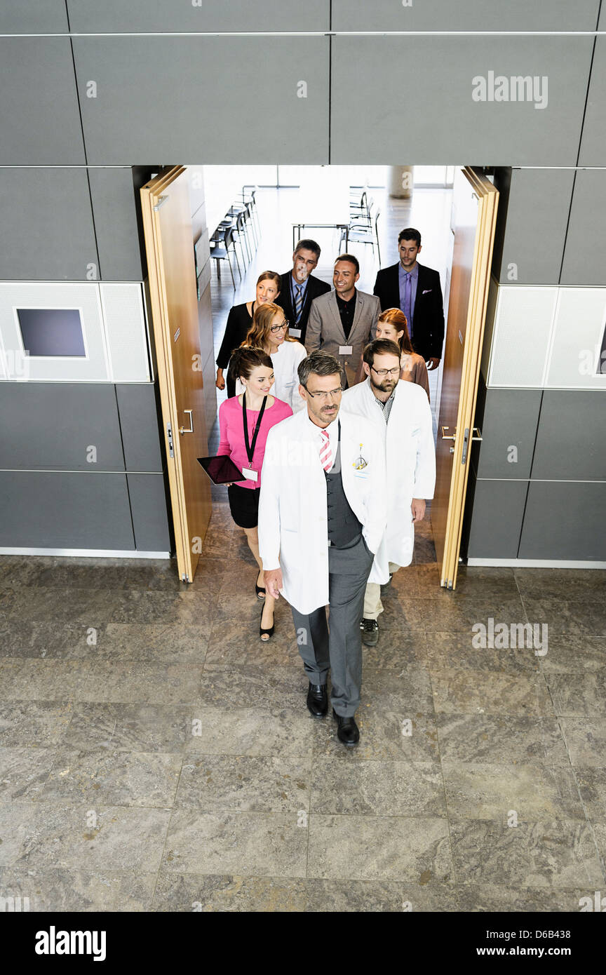 Doctor walking door hi-res stock photography and images - Alamy