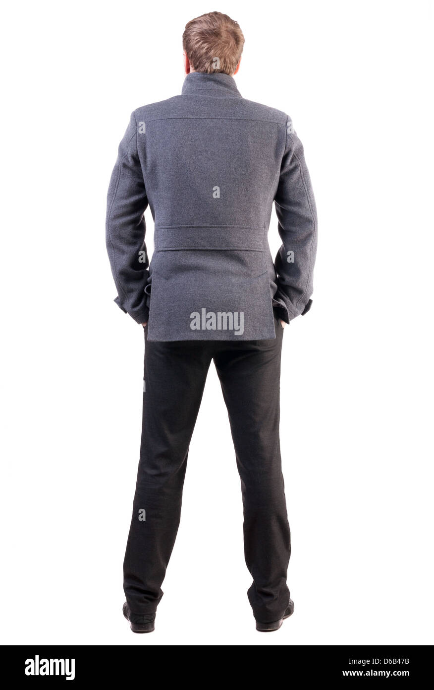 Back view of handsome business man in coat. Standing young businessman ...
