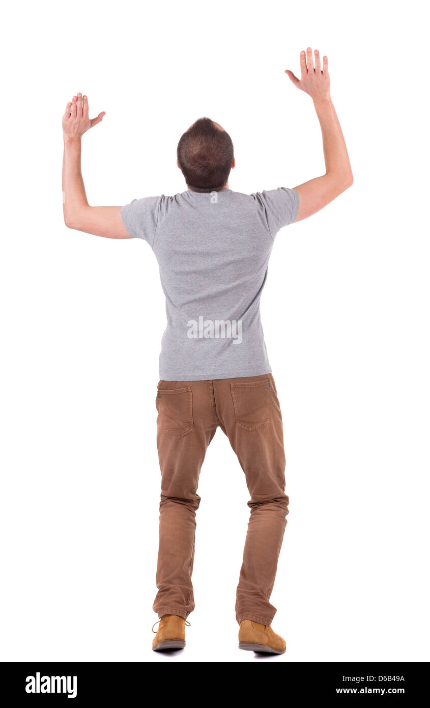 Back view of shocked man in shirt. Upset young guy in jeans and shirt ...