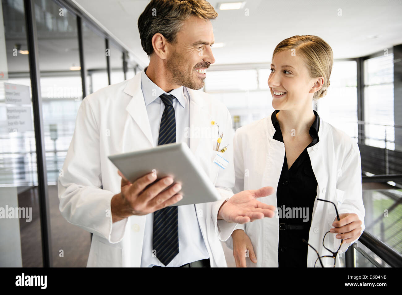 Doctors talking in hallway Stock Photo - Alamy