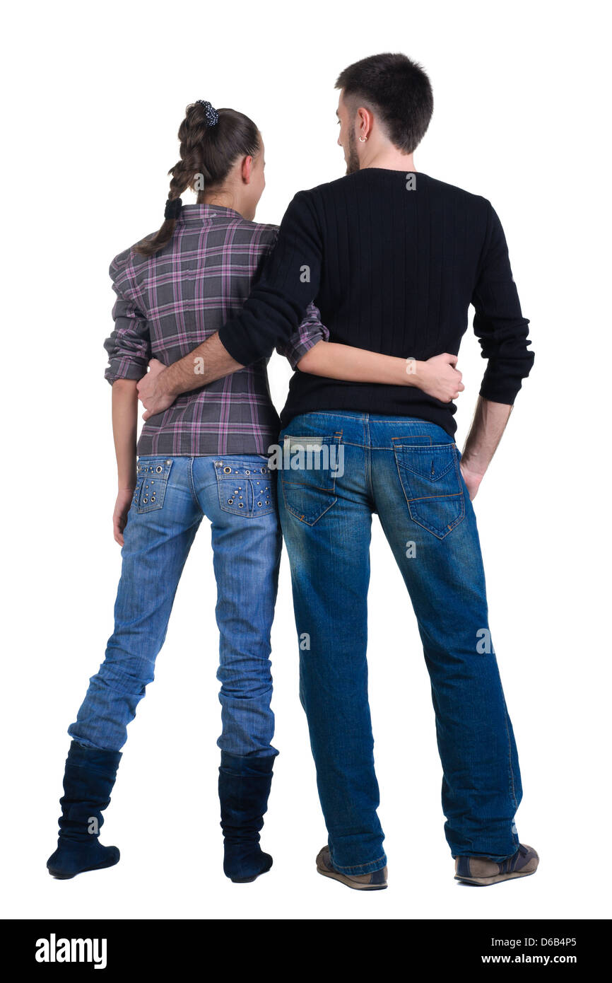 Young couple looks where that. Rear view. Isolated over white Stock ...