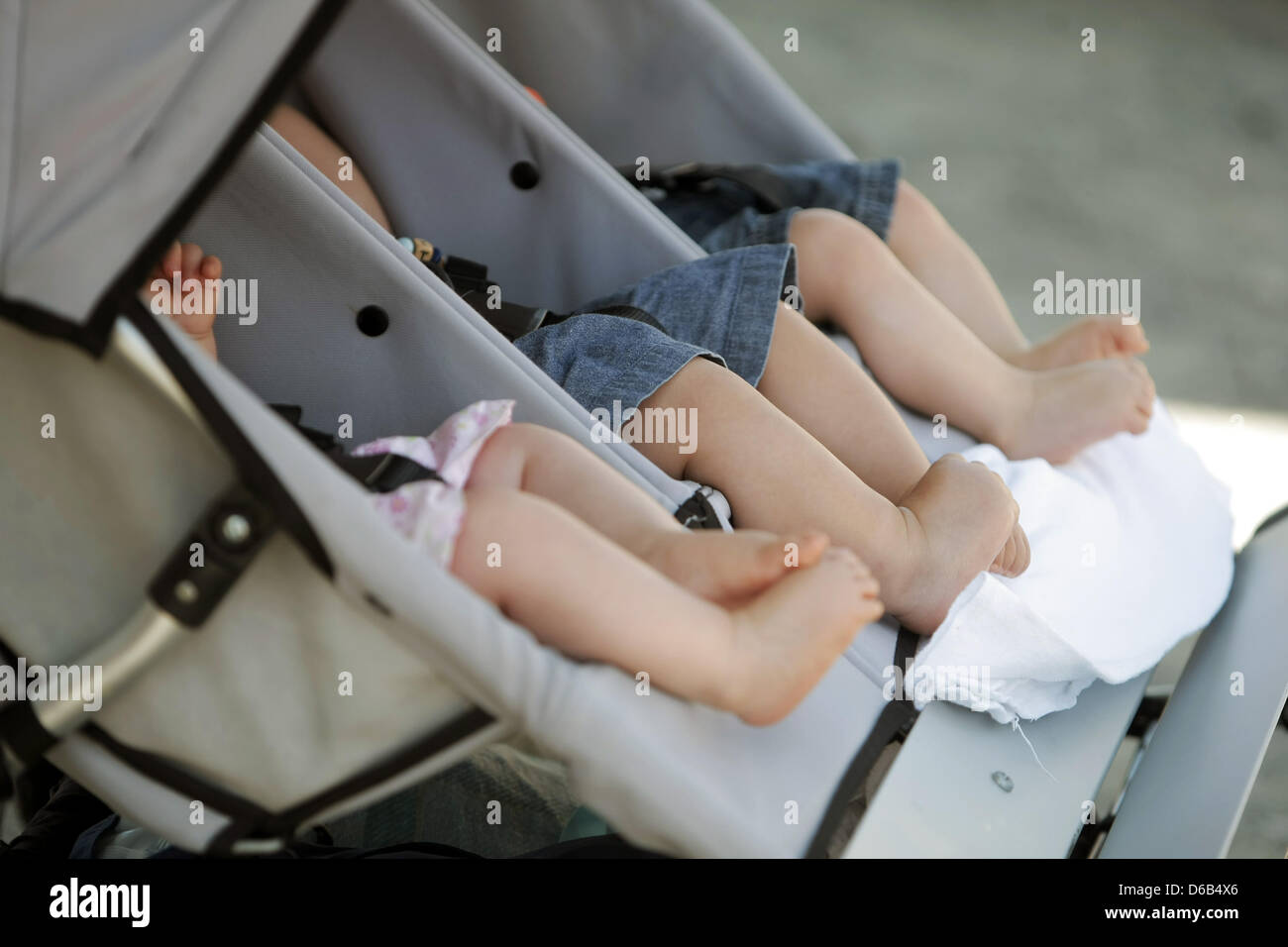 Triplets sit in their carriage during the triplets meeting at ...