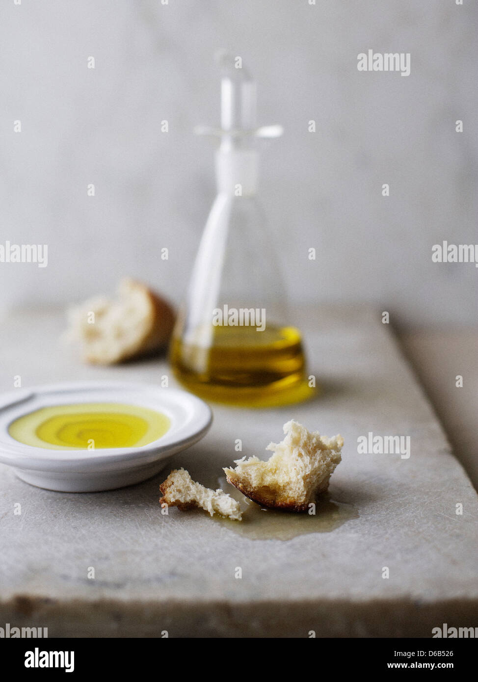 Plate of olive oil with crusty bread Stock Photo - Alamy