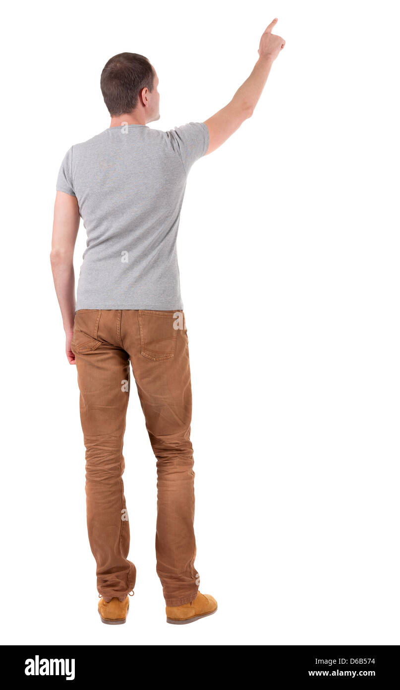 Back view of pointing young men in shirt and jeans. Young guy gesture ...