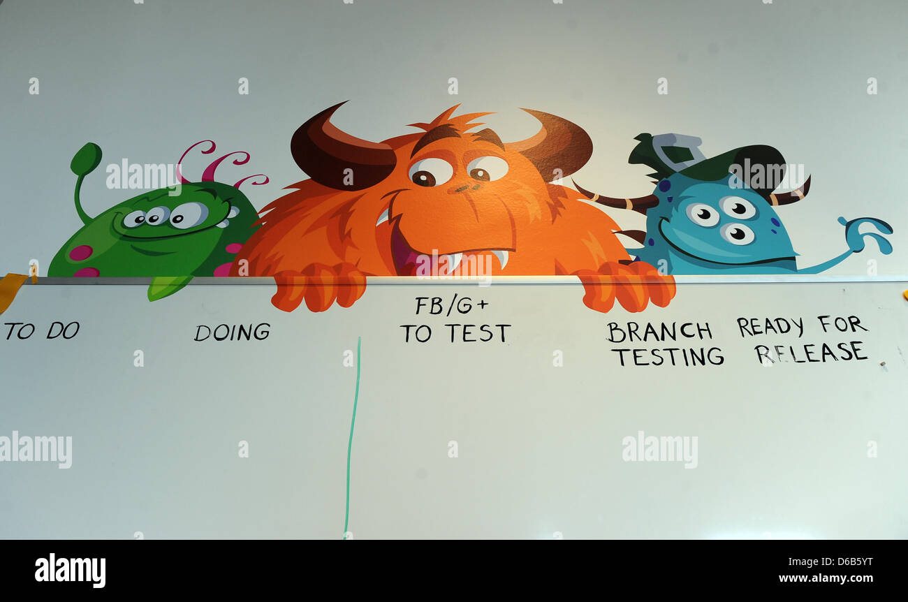 A whiteboard is decorated with pictures of the game characters Monster ...