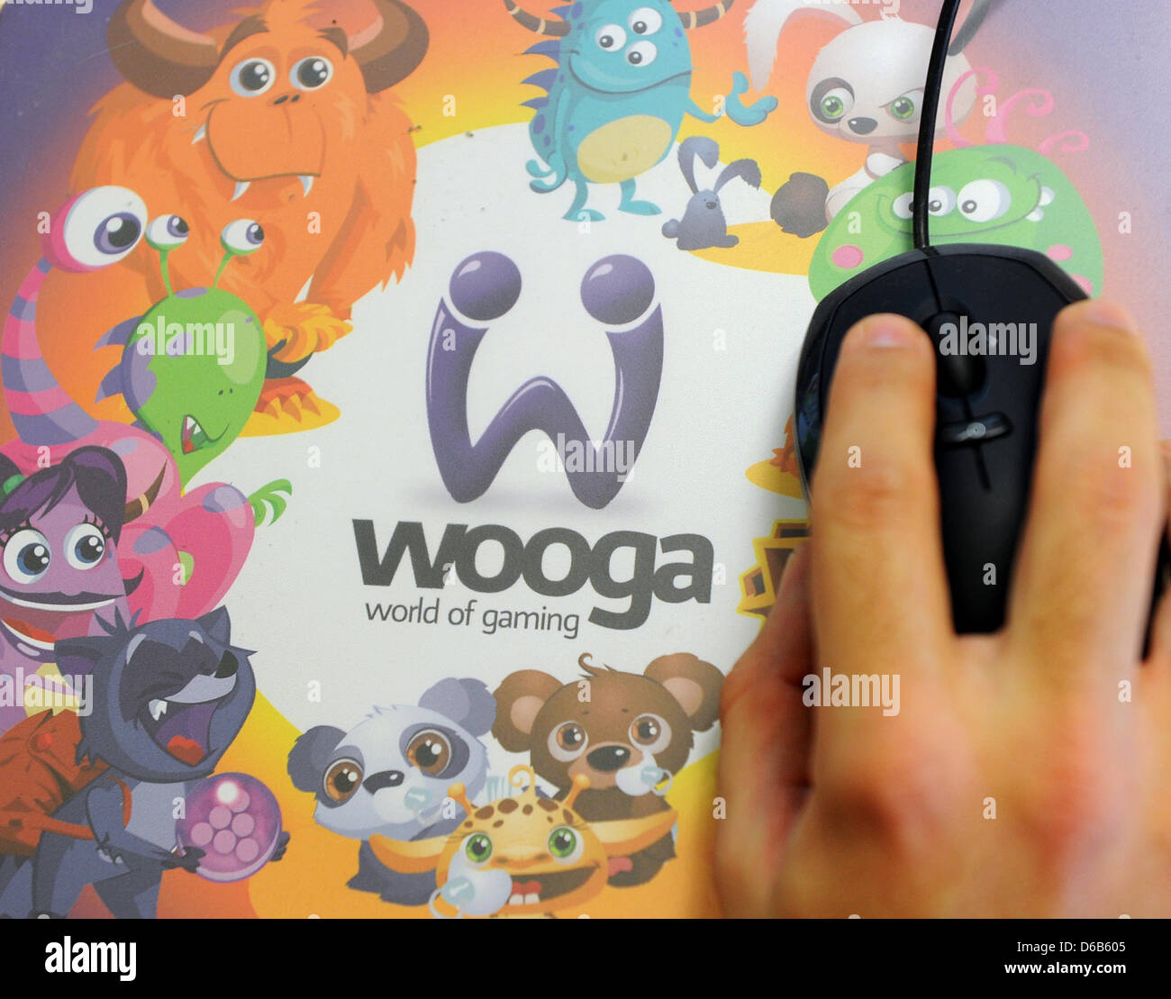 A hand moves a mouse at the headquarters of the Gaming software company ...